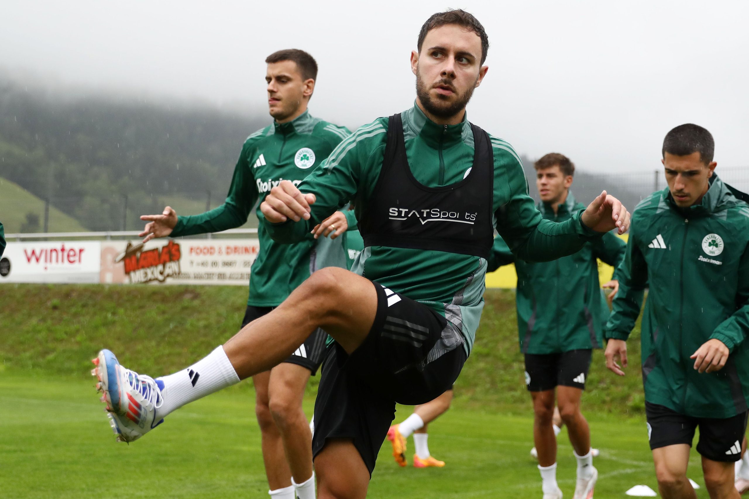 ΔΙΠΛΗ ΠΡΟΠΟΝΗΣΗ ΥΠΟ ΒΡΟΧΗ | PANATHINAIKOS FC OFFICIAL WEB SITE